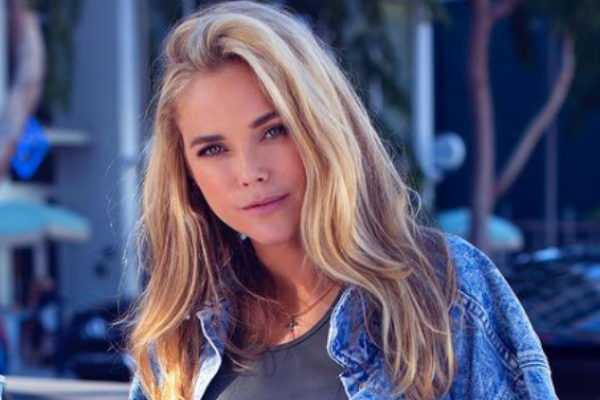 Model Kelly Hughes becomes 1st on Sports Illustrated cover to...